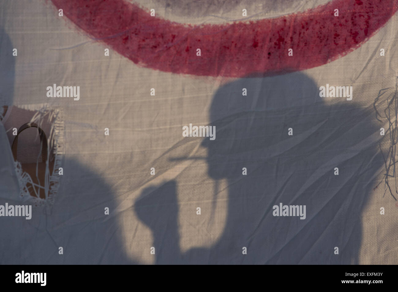 Athens, Greece. 13th July, 2015. A young protester standing behind a ...