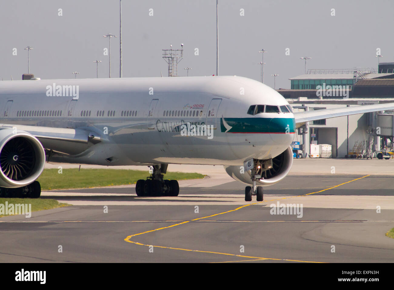Cathay Pacific Boeing 777 taxiing on Manchester Airport taxiway Stock ...