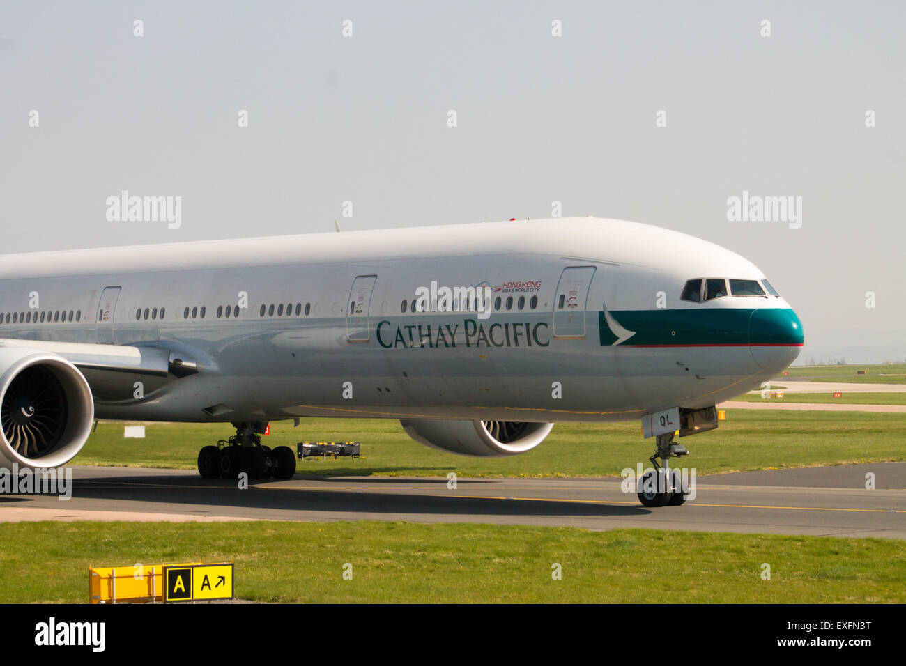 Cathay Pacific Boeing 777 taxiing on Manchester Airport taxiway Stock ...