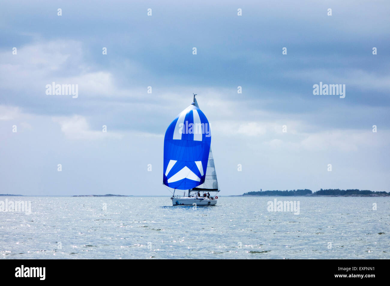 Sailing boat with spinnaker sail set Stock Photo - Alamy