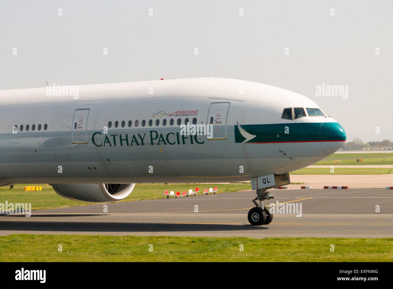 Cathay Pacific Boeing 777 taxiing on Manchester Airport taxiway Stock ...