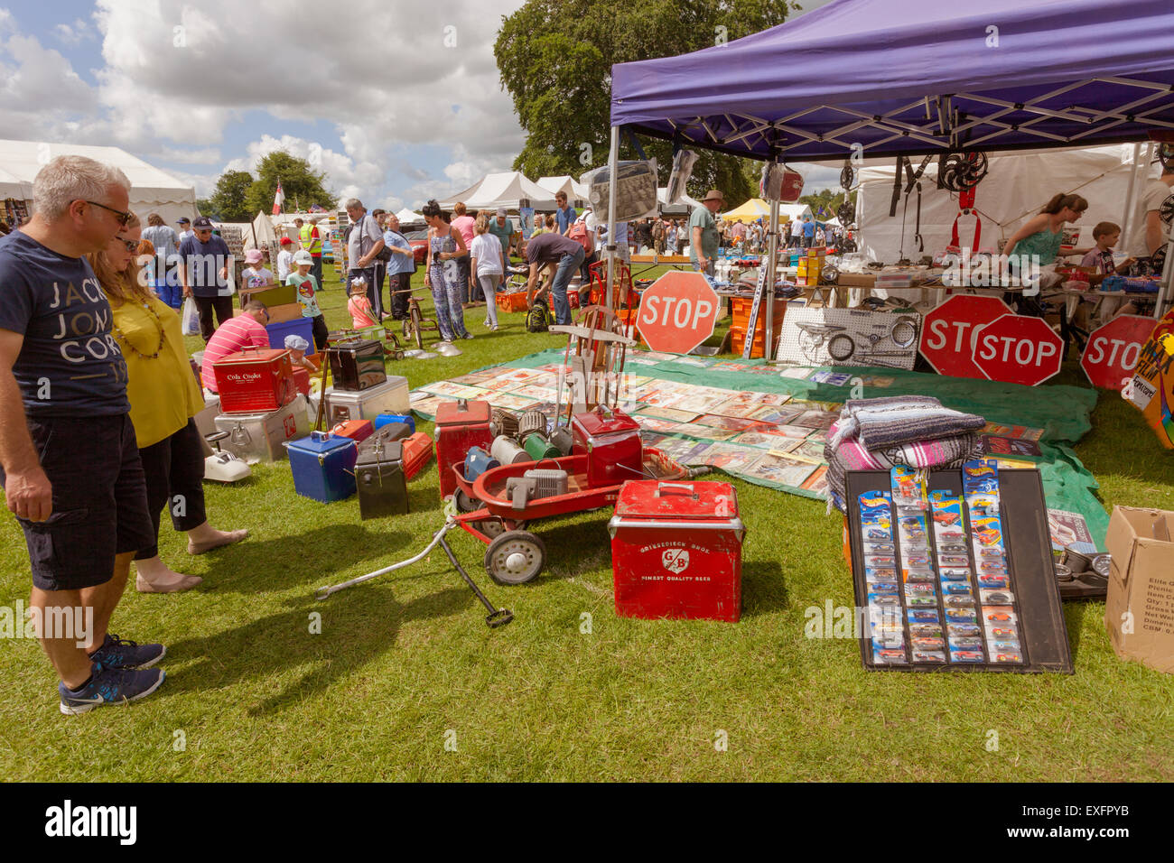 Outdoor market stall at a classic car show, selling car parts and tools ...