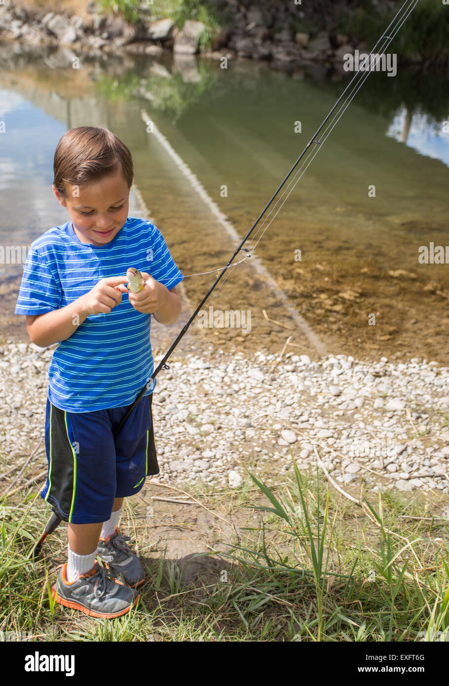 Young boy showing the fish he caught Stock Photo - Alamy