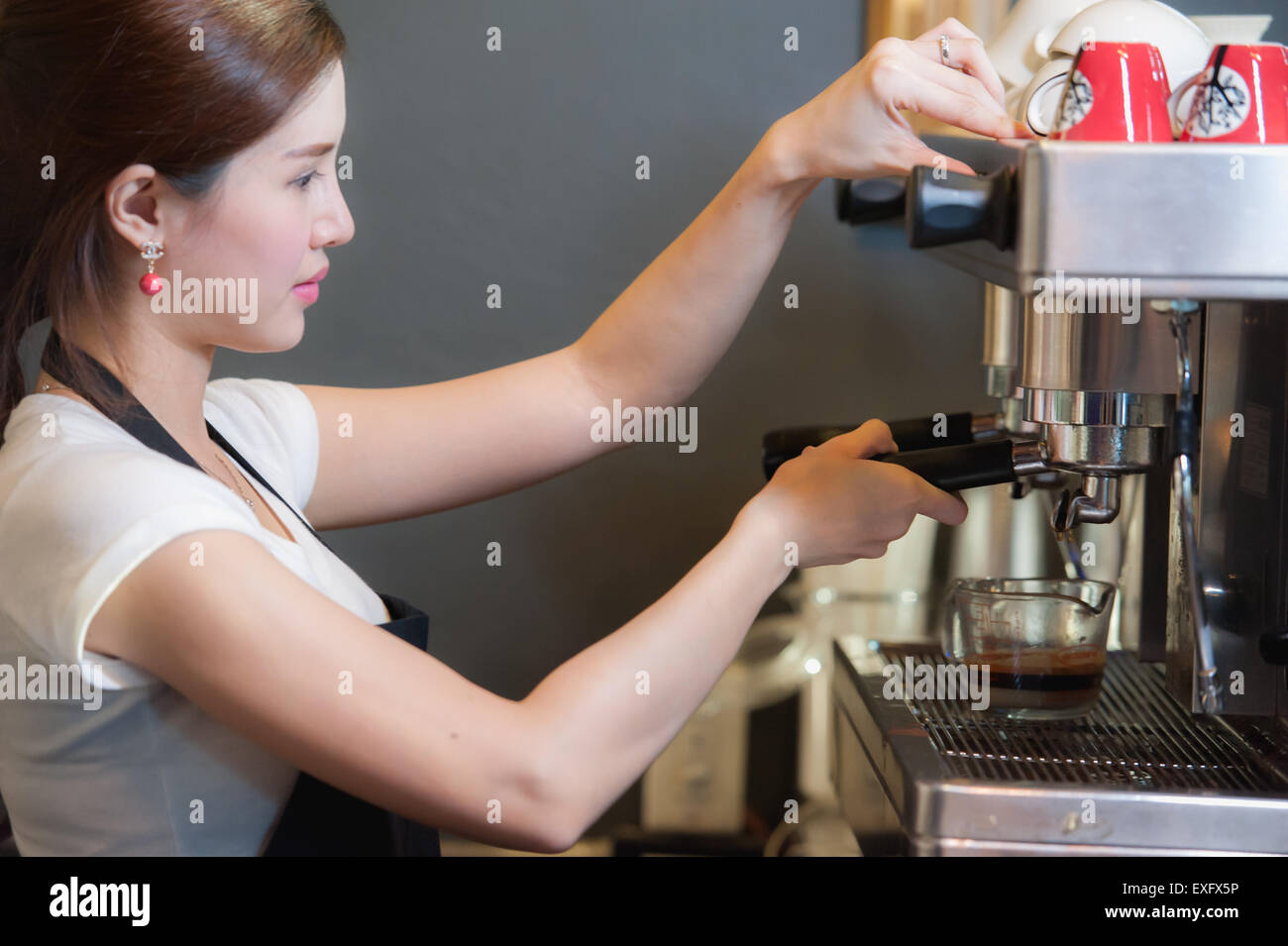 Female bartender makes coffee using coffee machine Stock Photo - Alamy