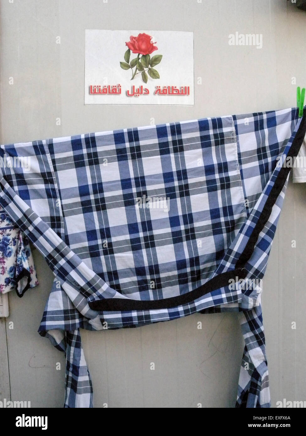 Arbil, Iraq. 12th July, 2015. A banner that reminds all refugees to ...