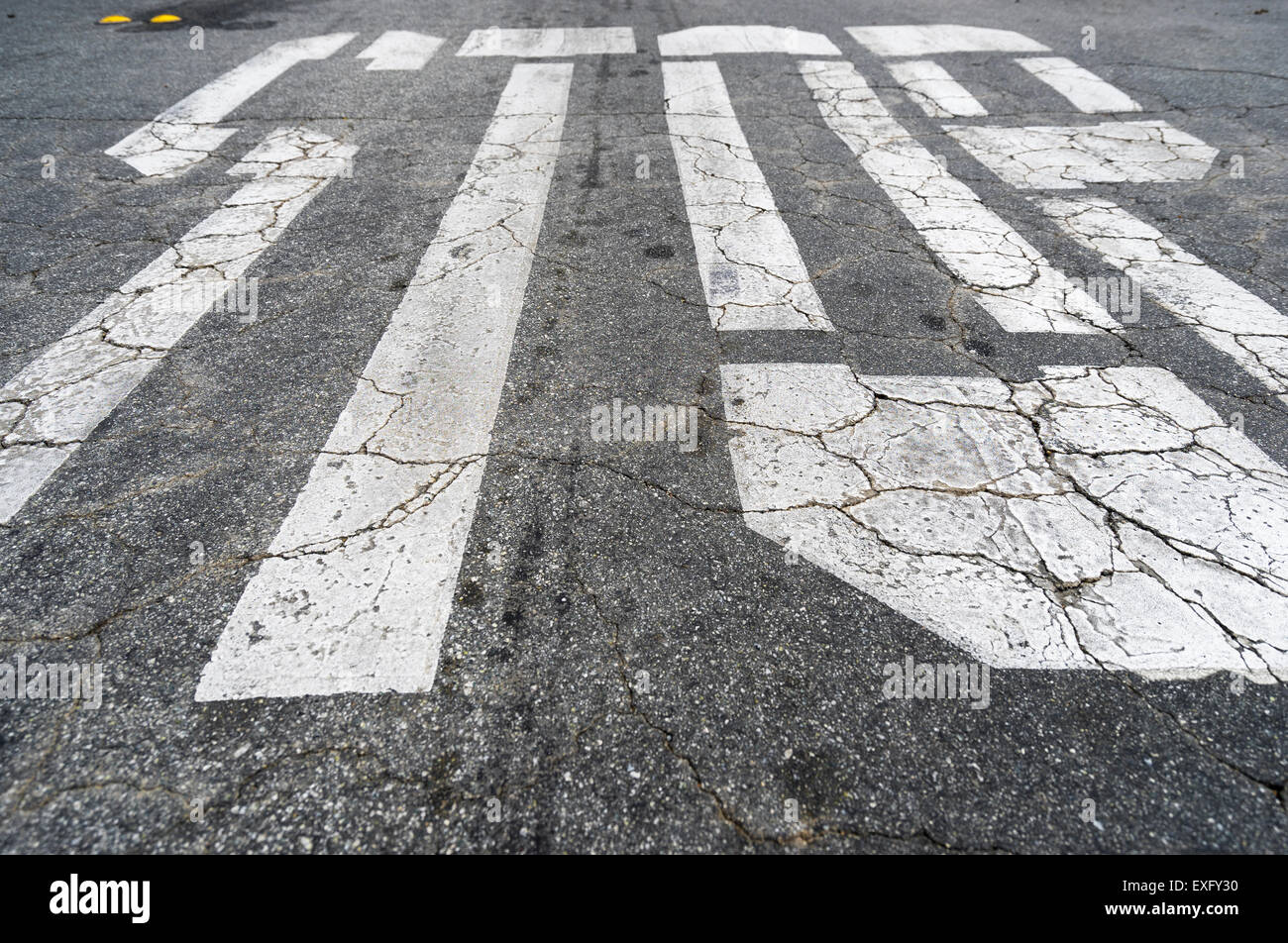 The Word Stop Painted On The Road With Cracks In The Pavement Stock Photo Alamy the-word-stop-painted-on-the-road-with-cracks-in-the-pavement-stock-photo-alamy