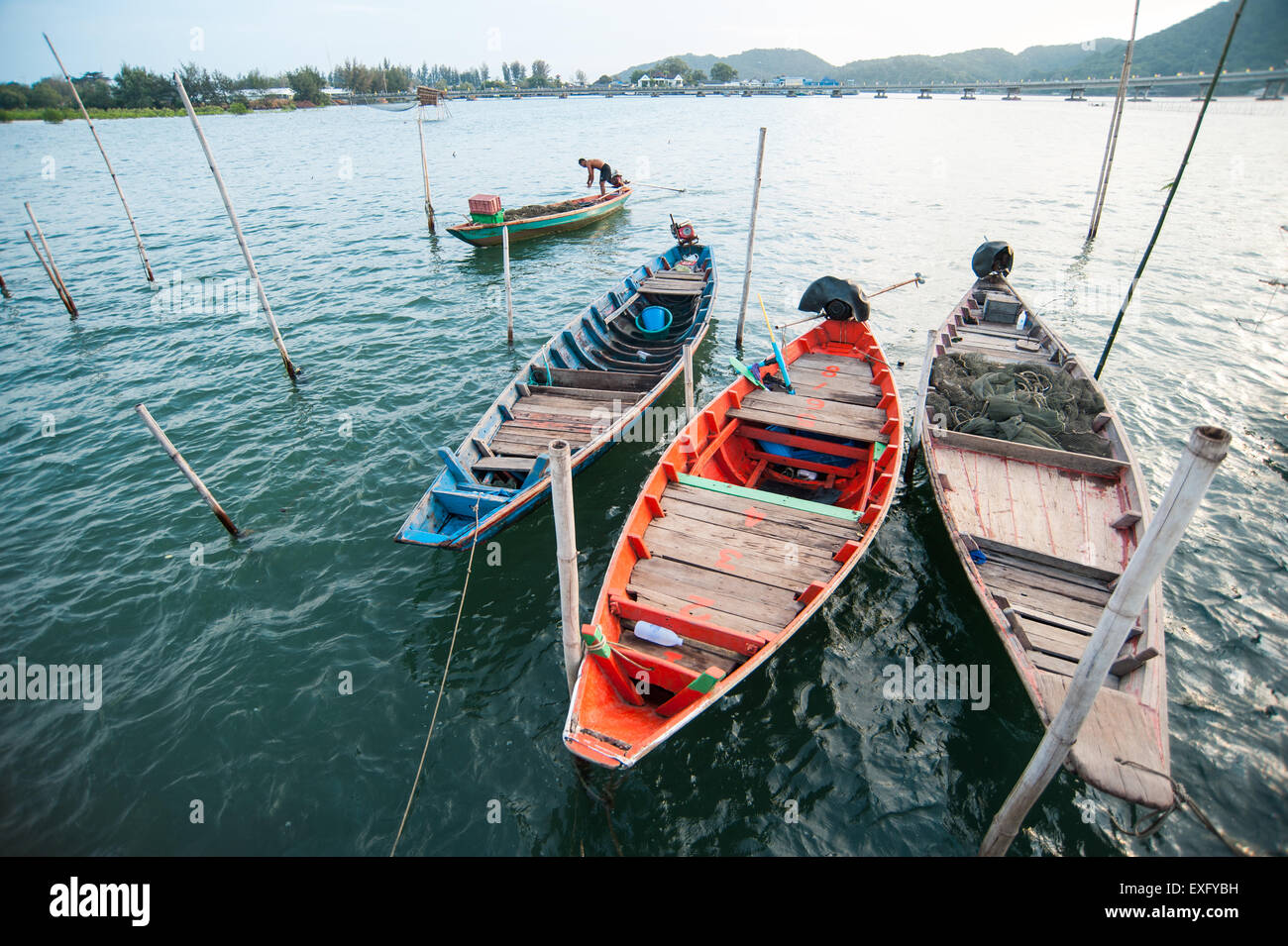 Small fishing boats dock at the shore Stock Photo - Alamy