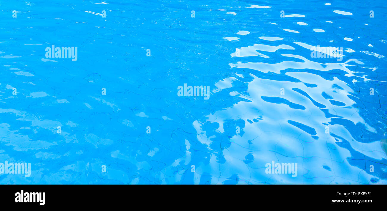 Blue water in the swimming pool with a wave Stock Photo - Alamy