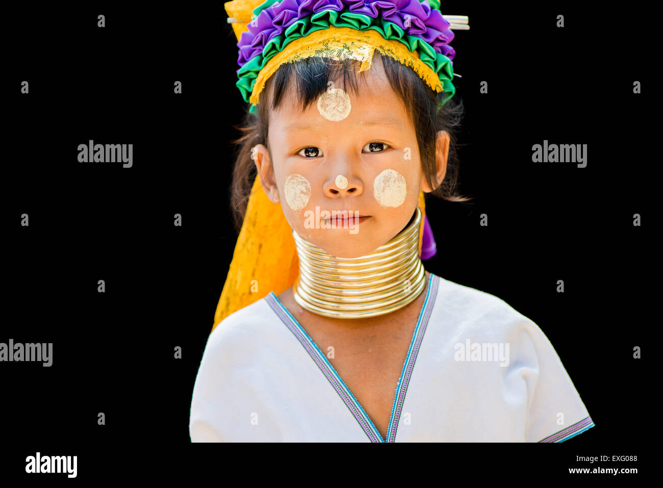 Young Kayan hill tribe girl with a black background in Chiang Mai ...