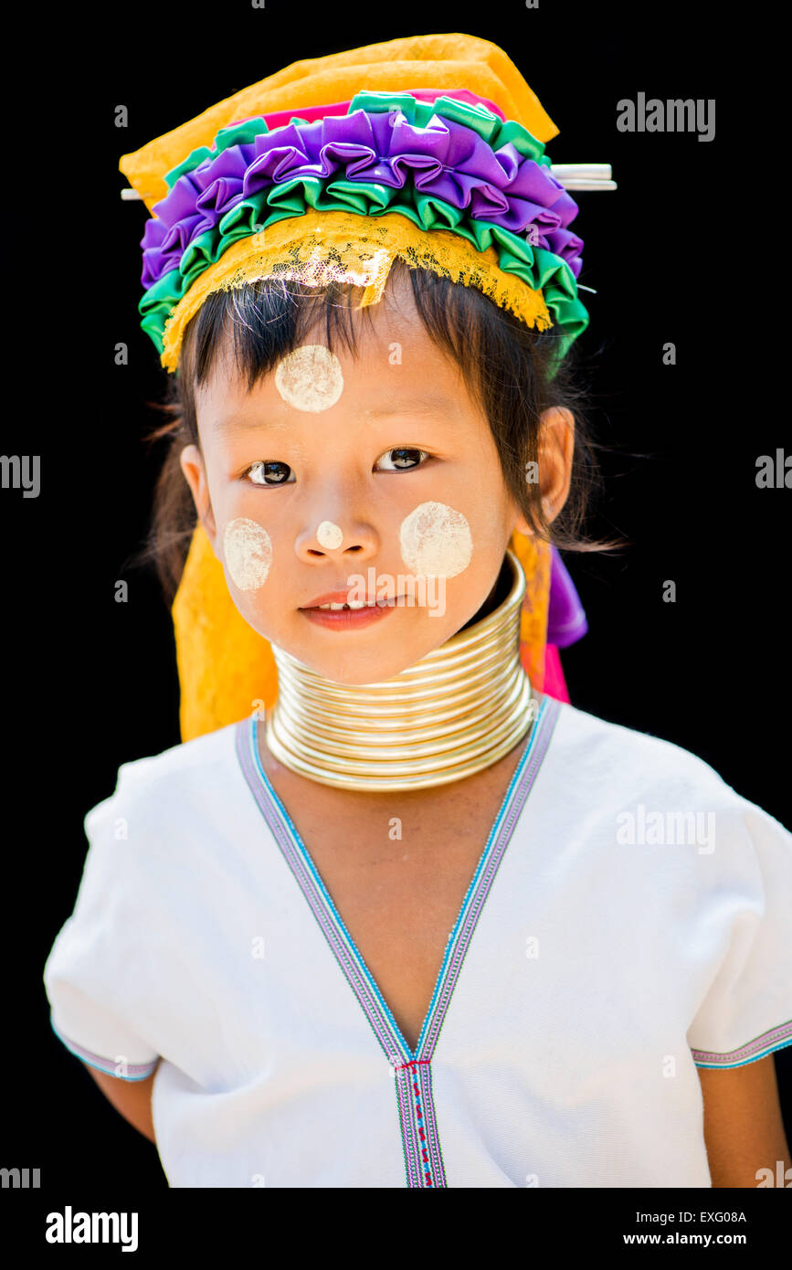 Young Kayan hill tribe girl with a black background in Chiang Mai ...