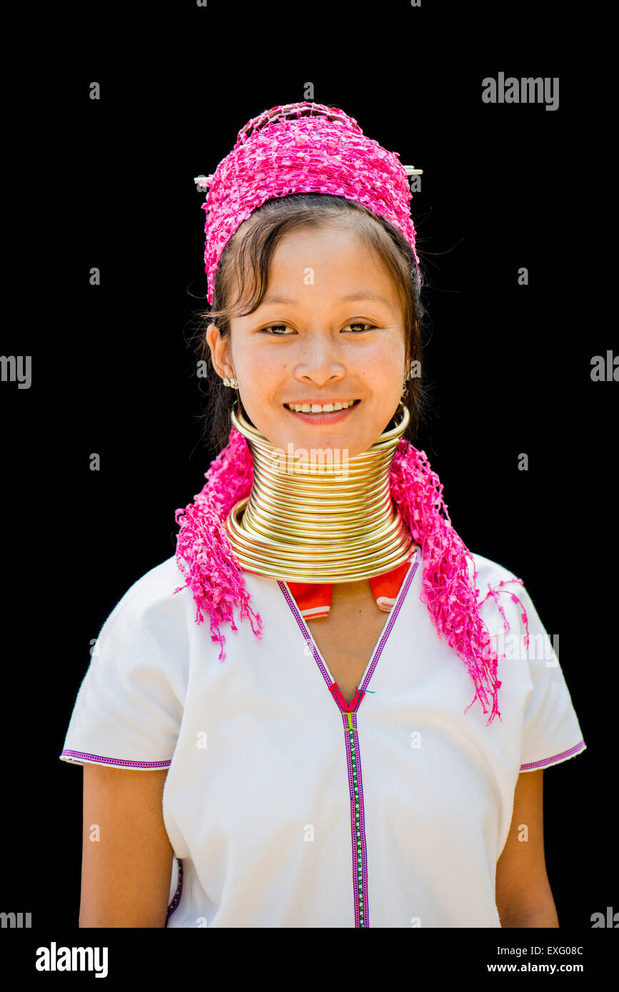Portrait of a young Kayan hill tribe woman against a black background ...