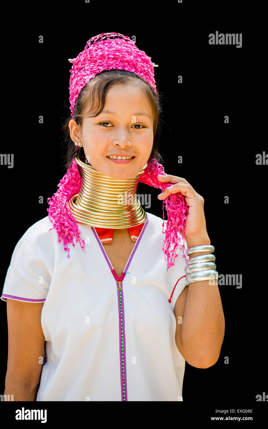 Portrait of a young Kayan hill tribe woman against a black background ...