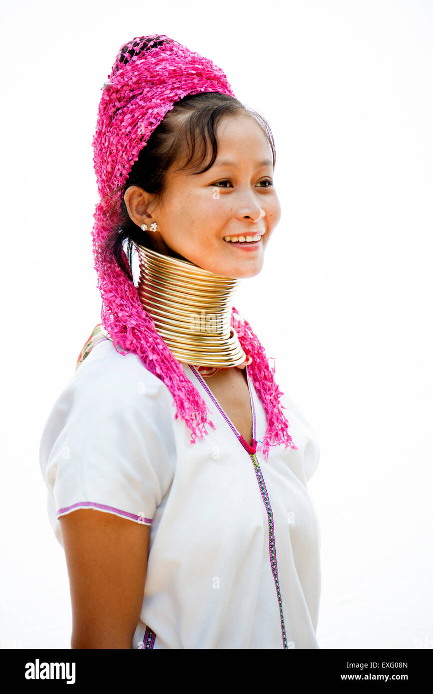Portrait of a young Kayan hill tribe woman against a white background ...