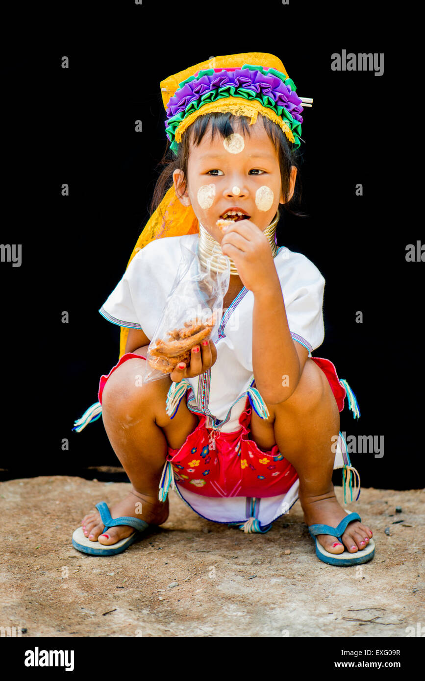Young Kayan hill tribe girl with a black background in Chiang Mai ...