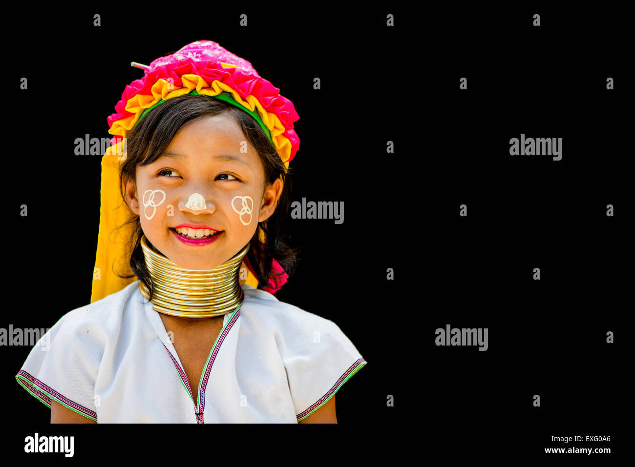 Young Kayan hill tribe girl with a black background in Chiang Mai ...