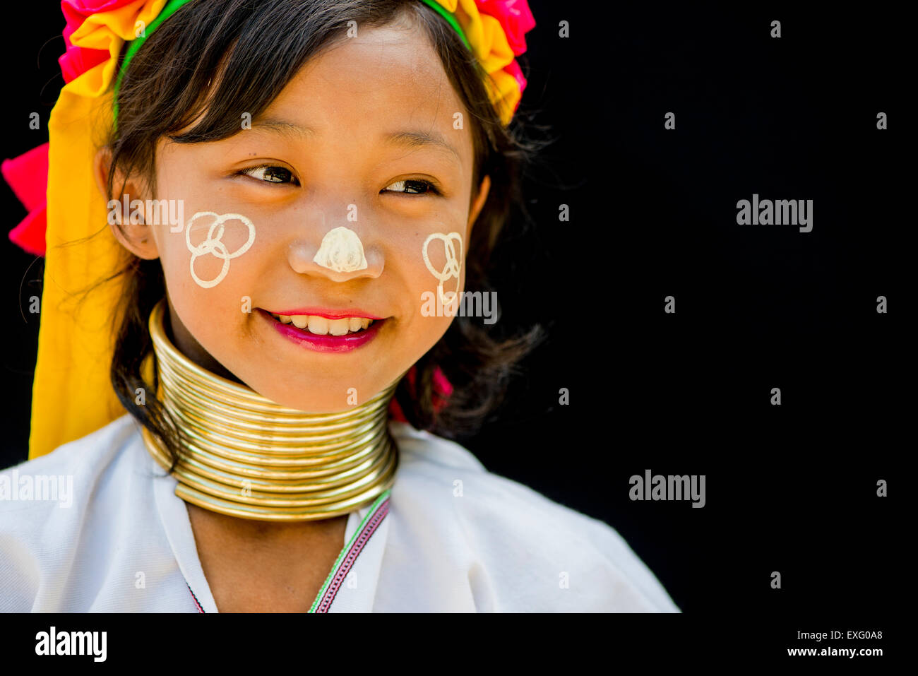 Young Kayan hill tribe girl with a black background in Chiang Mai ...