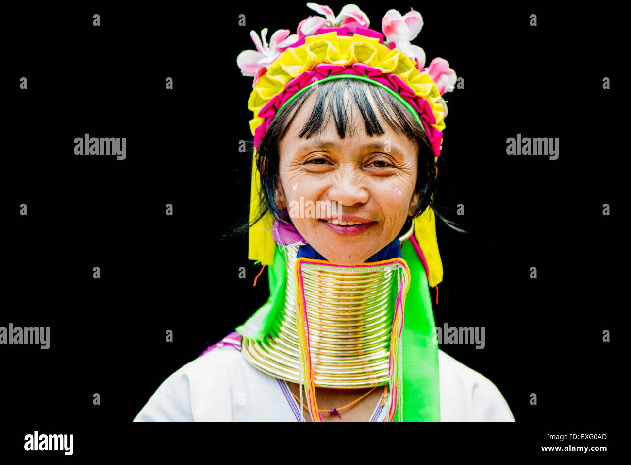 Senior Kayan hill tribe woman portrait against a black background in ...