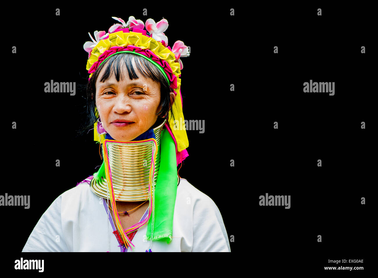 Senior Kayan hill tribe woman portrait against a black background in ...
