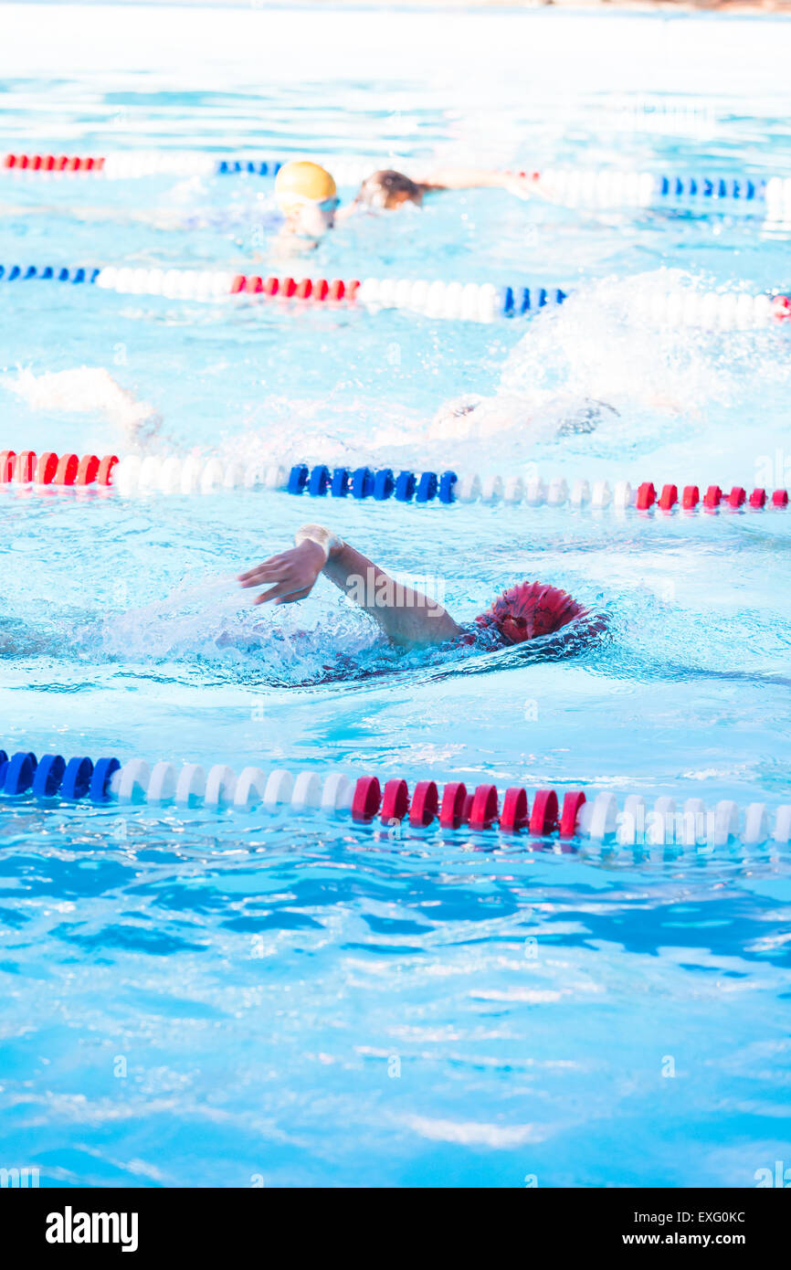 Kids swim meet in outdoor pool during the summer Stock Photo - Alamy