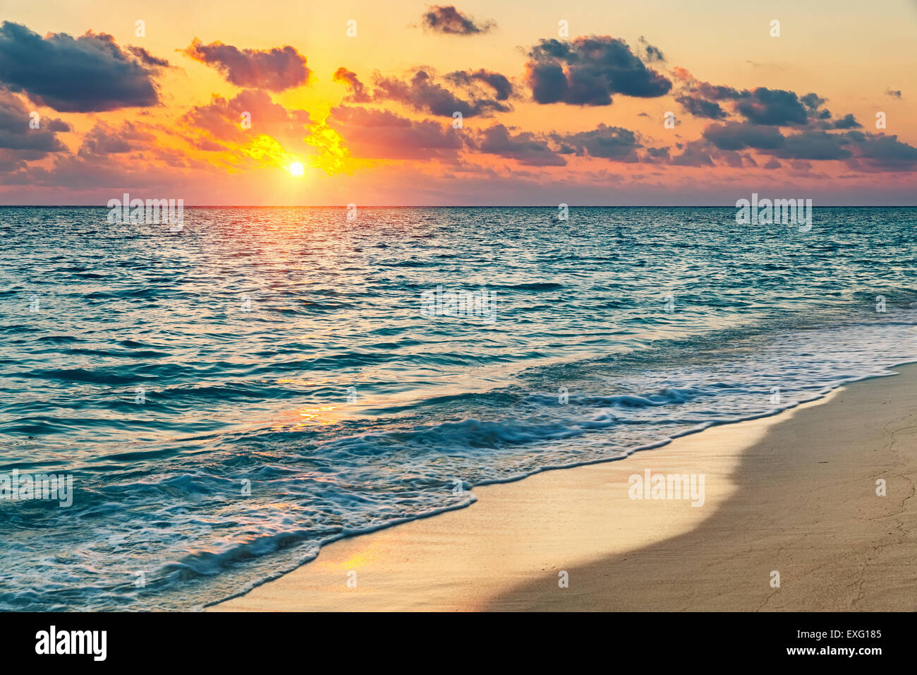 Sunset over ocean Stock Photo - Alamy