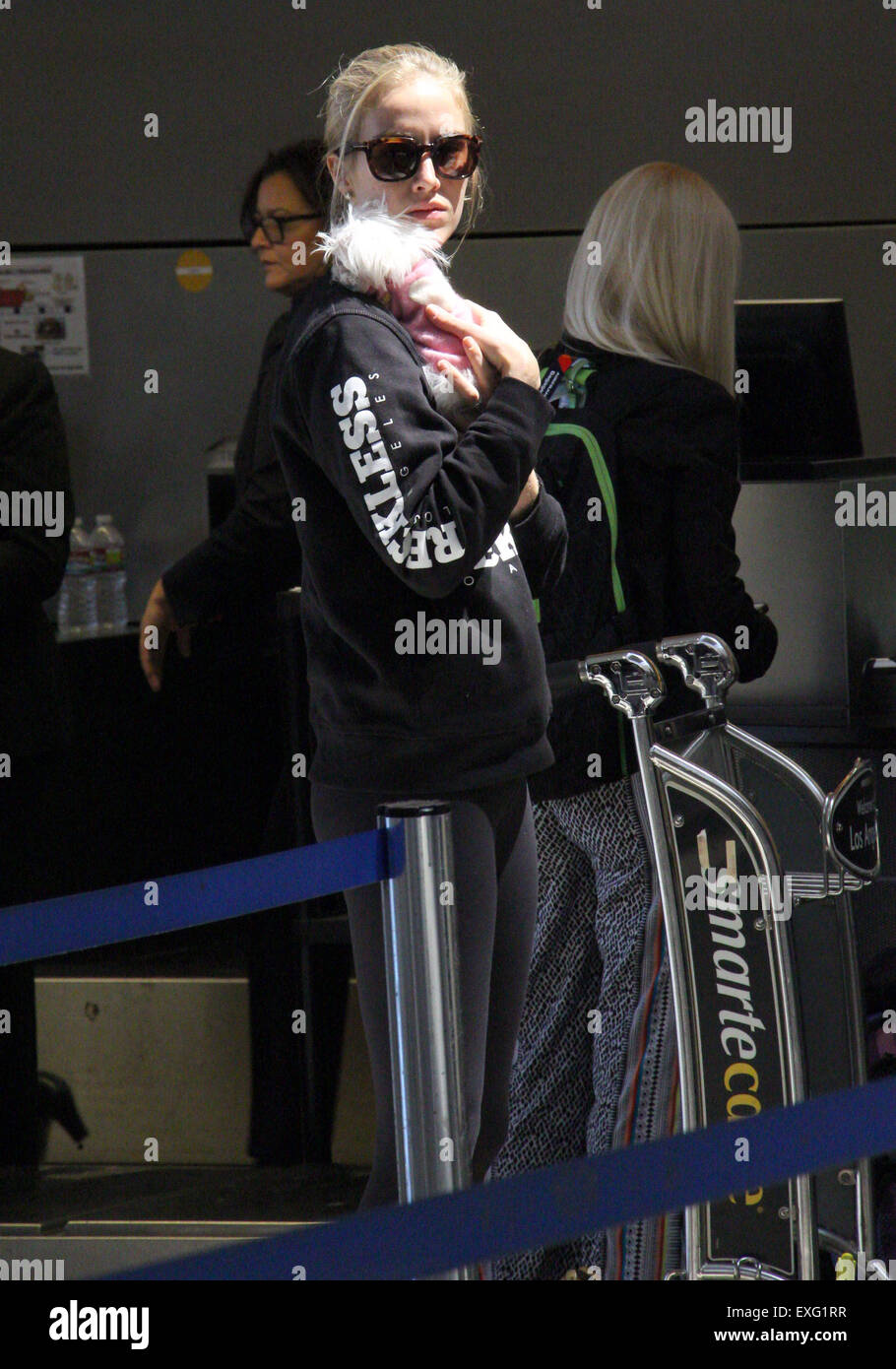 Elizabeth Whitson waits to check in to her flight at Los Angeles ...