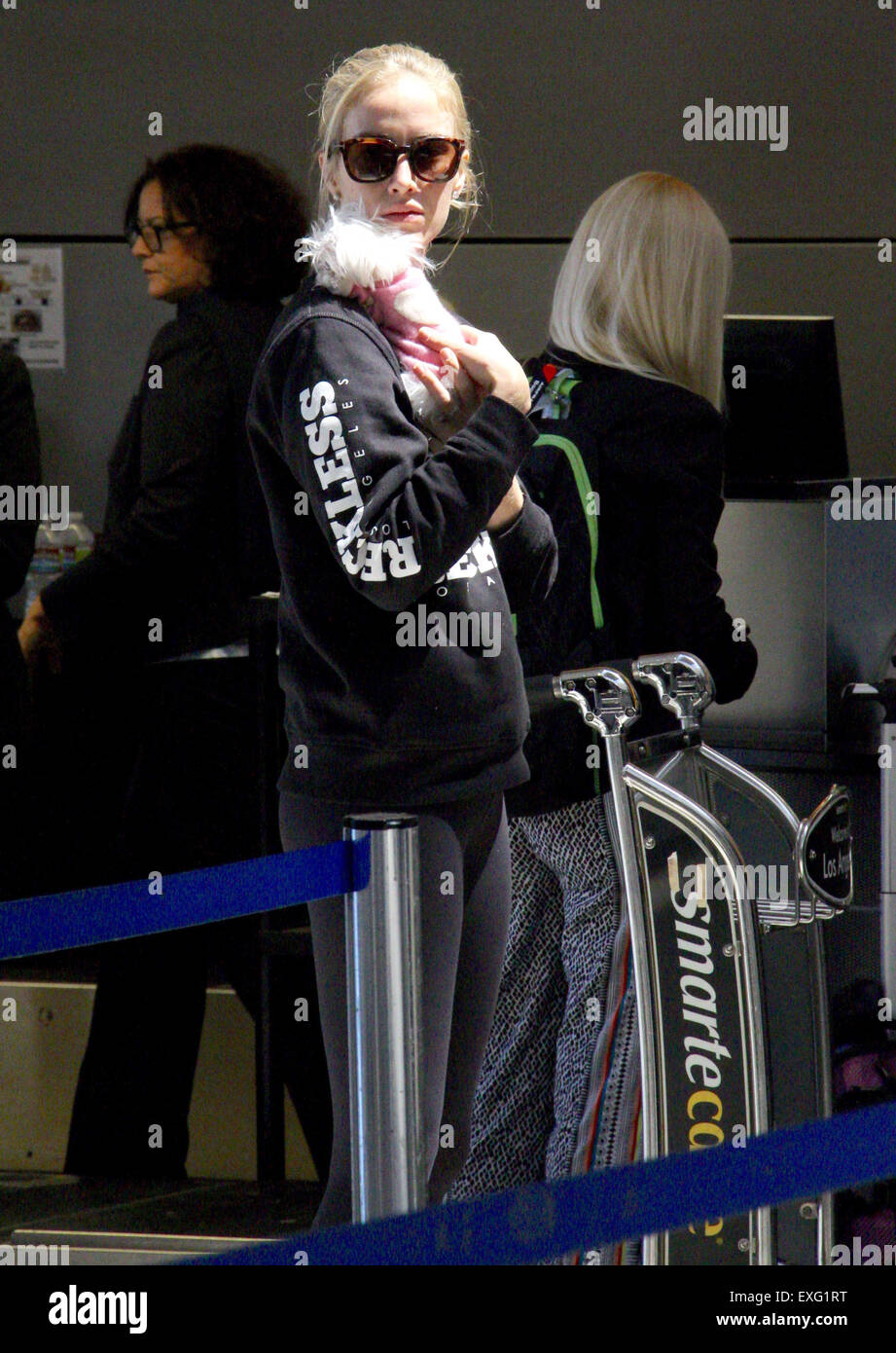 Elizabeth Whitson waits to check in to her flight at Los Angeles ...