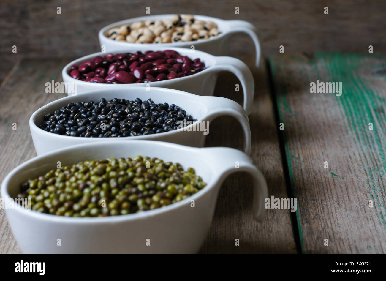 Four types of dry beans in the bowl Stock Photo - Alamy