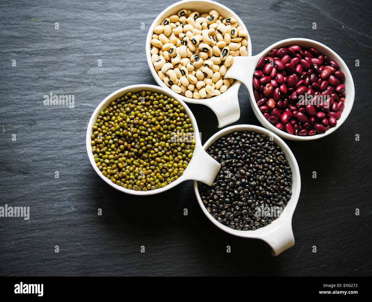 Four types of dry beans in the bowl Stock Photo - Alamy