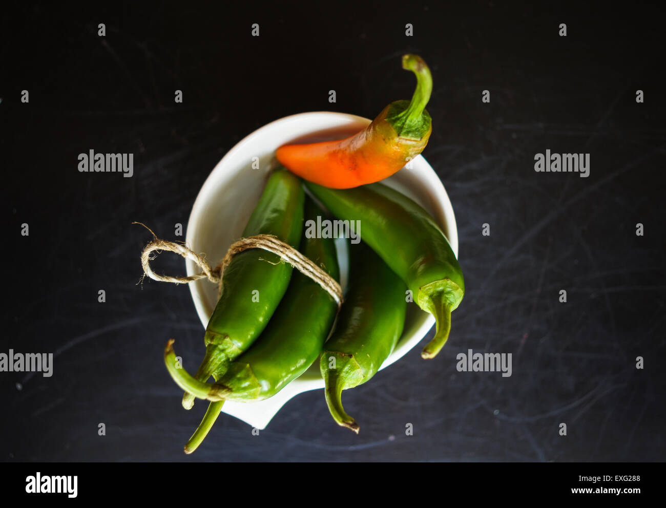 closeup green chilli peppers and different types of peppercorns Stock ... closeup green chilli peppers and different types of peppercorns Stock ...