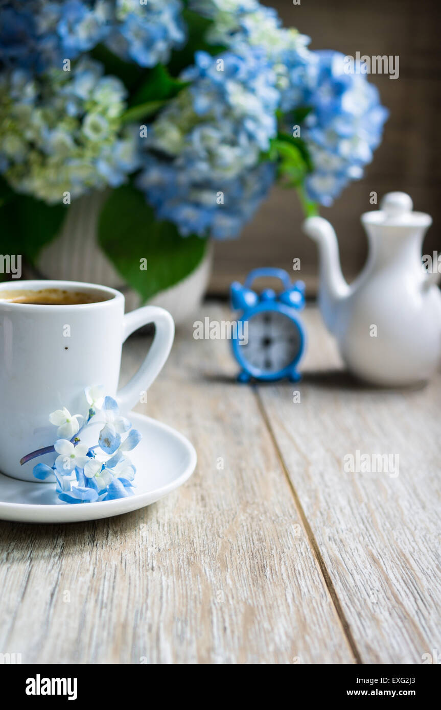 Blue pastel color hydrangea flowers and good morning note on wooden ...