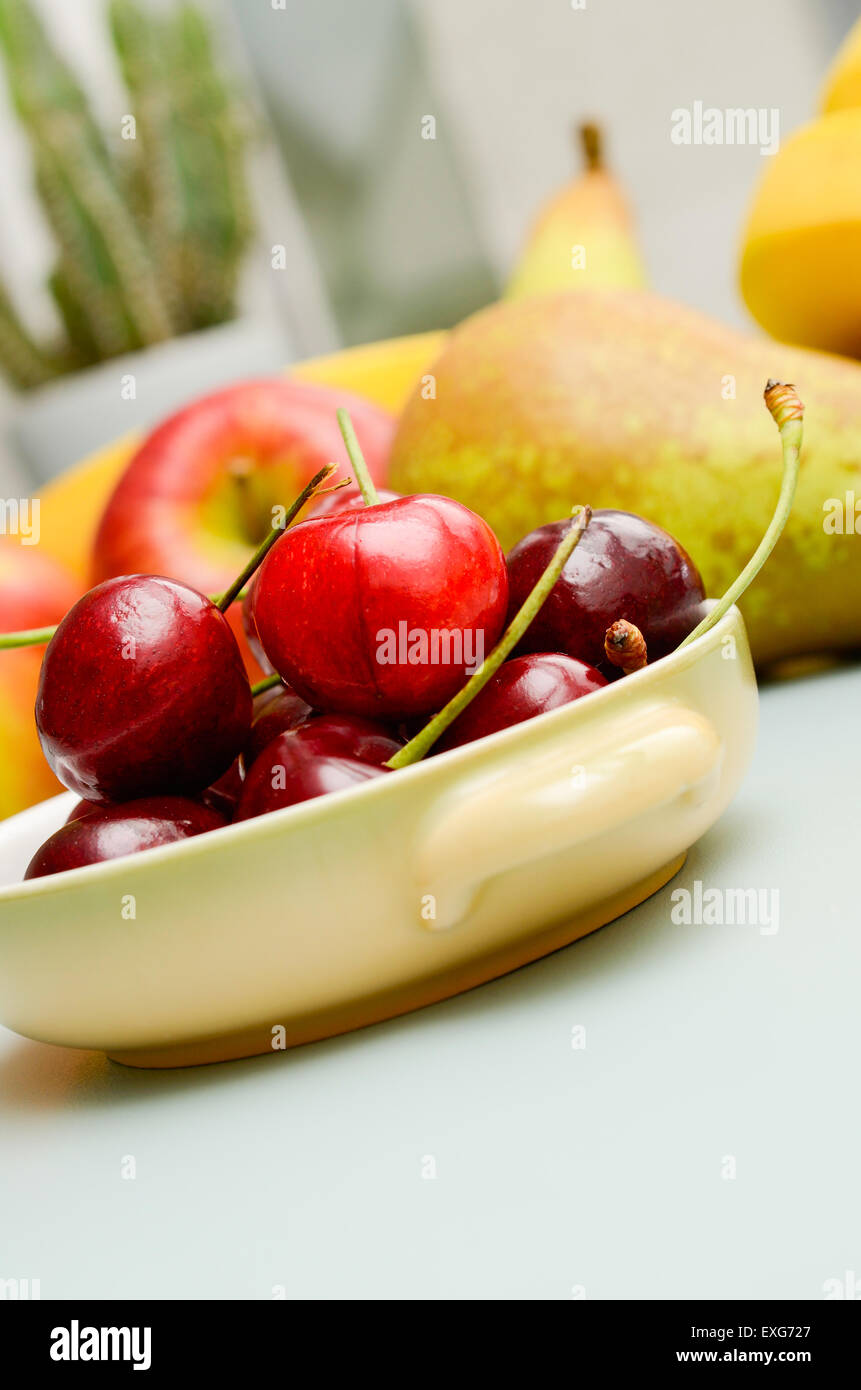 Delicious cherries on a kitchen table Stock Photo - Alamy