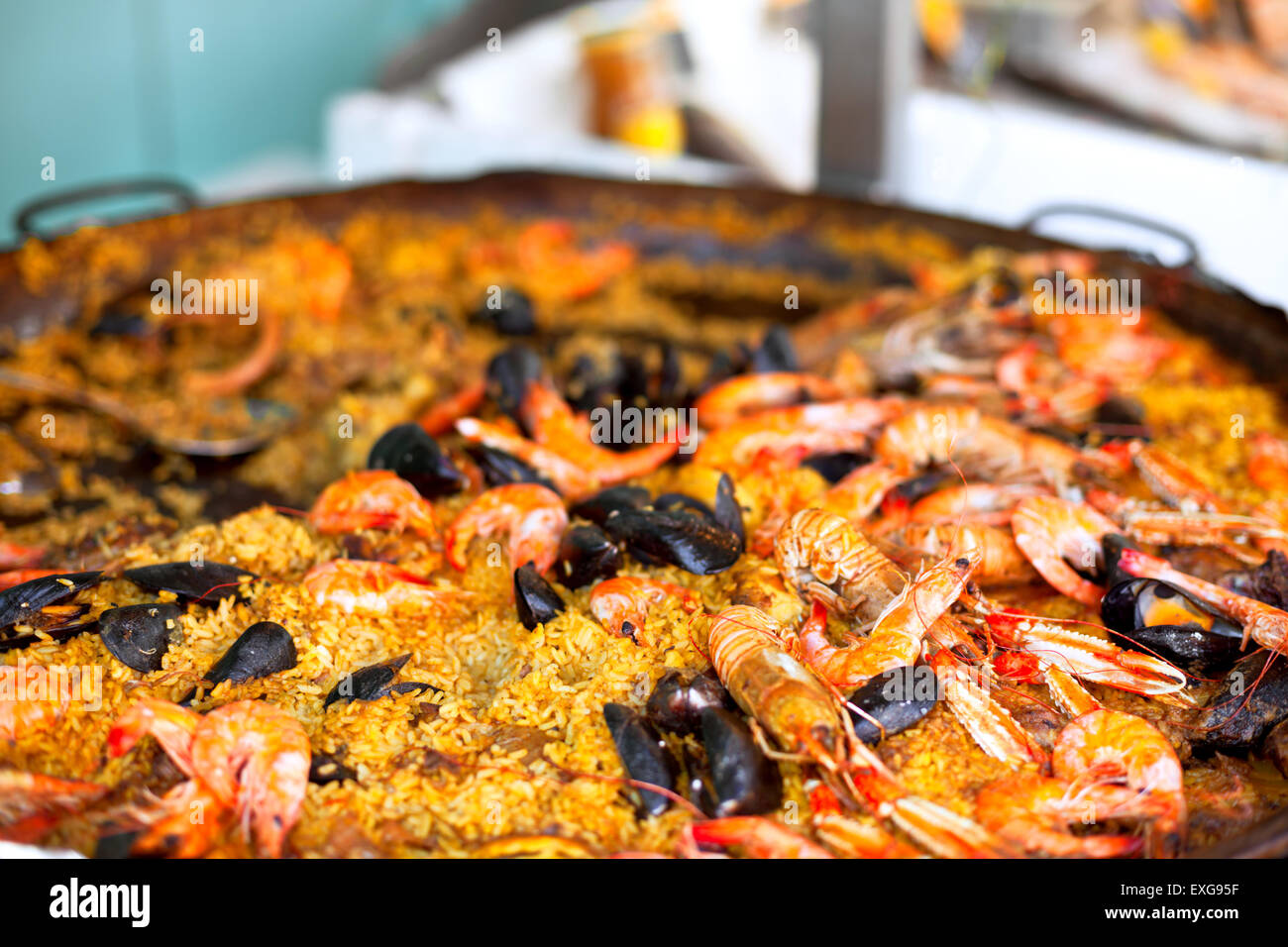 Traditional paella with seafood in a market. Shoted at Provence, France ...