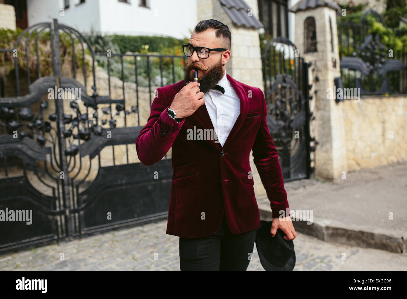 rich man in a jacket near his house Stock Photo - Alamy