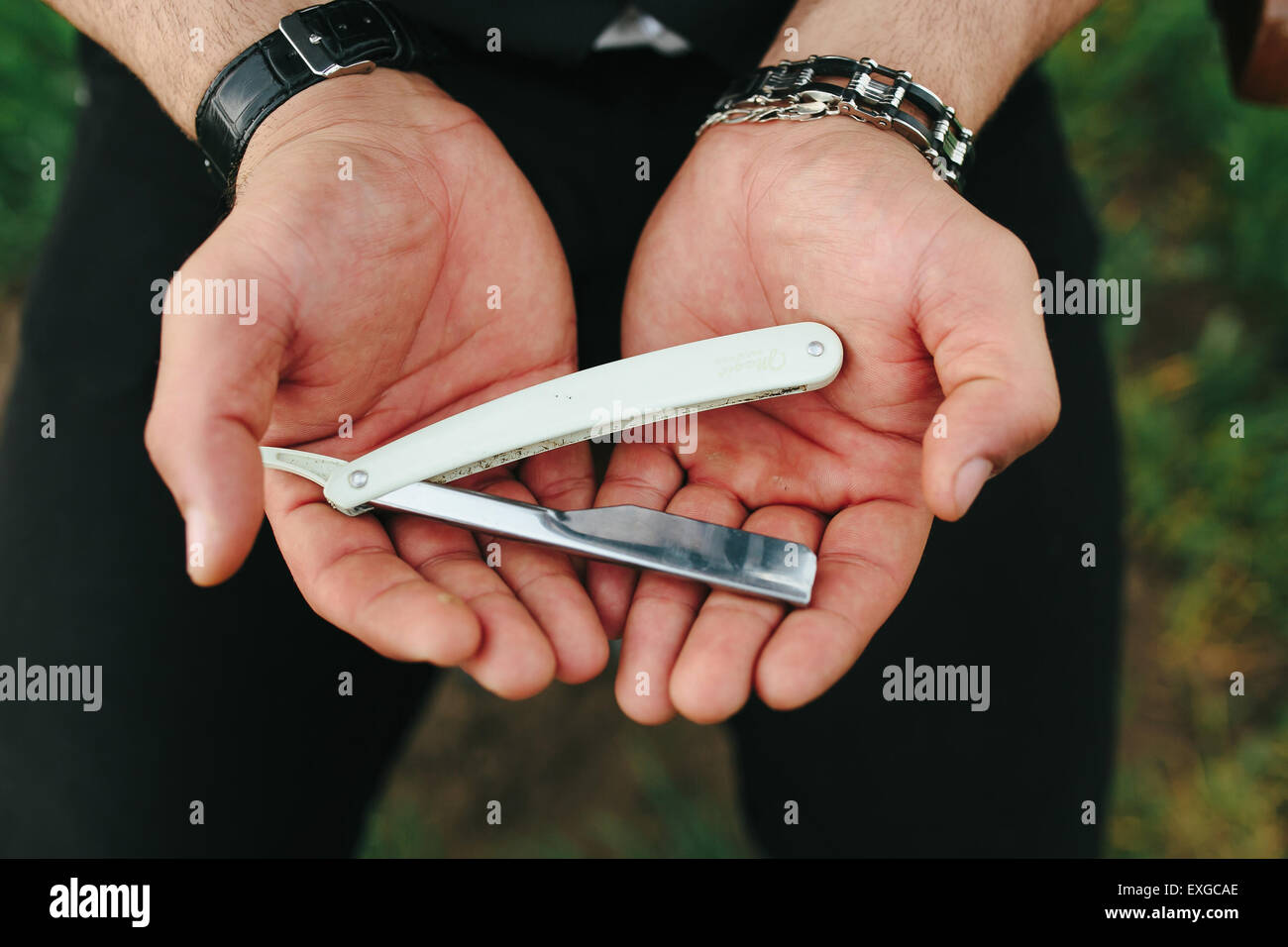 ancient blade in the hands of men Stock Photo - Alamy