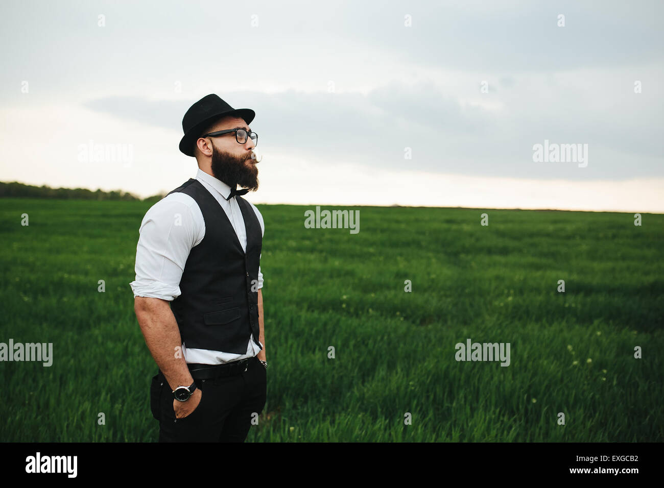 man with a beard walking on the field Stock Photo - Alamy