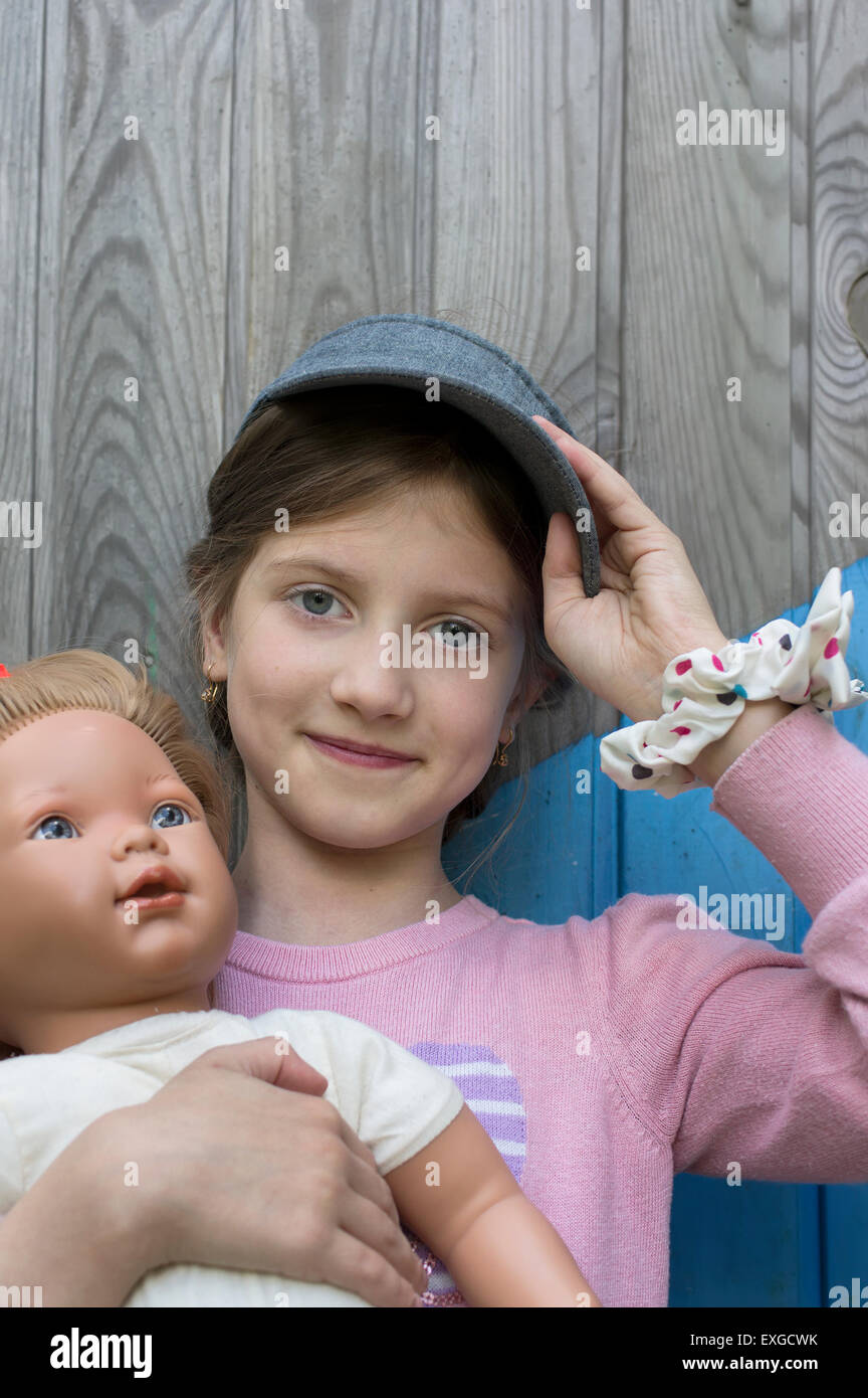 Girl With Doll Stock Photo - Alamy