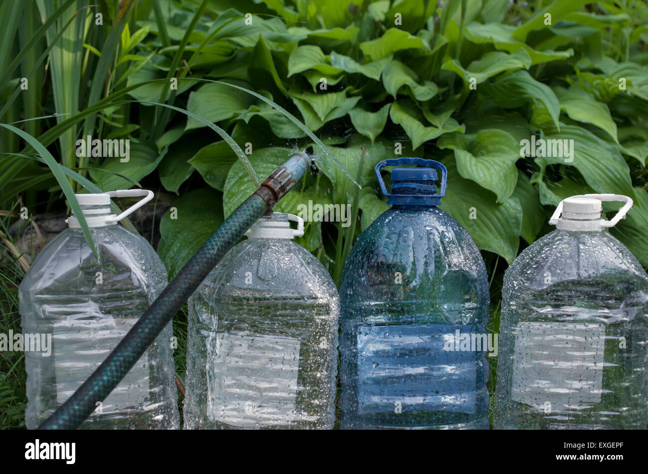 Plastic Canisters With Water Stock Photo - Alamy