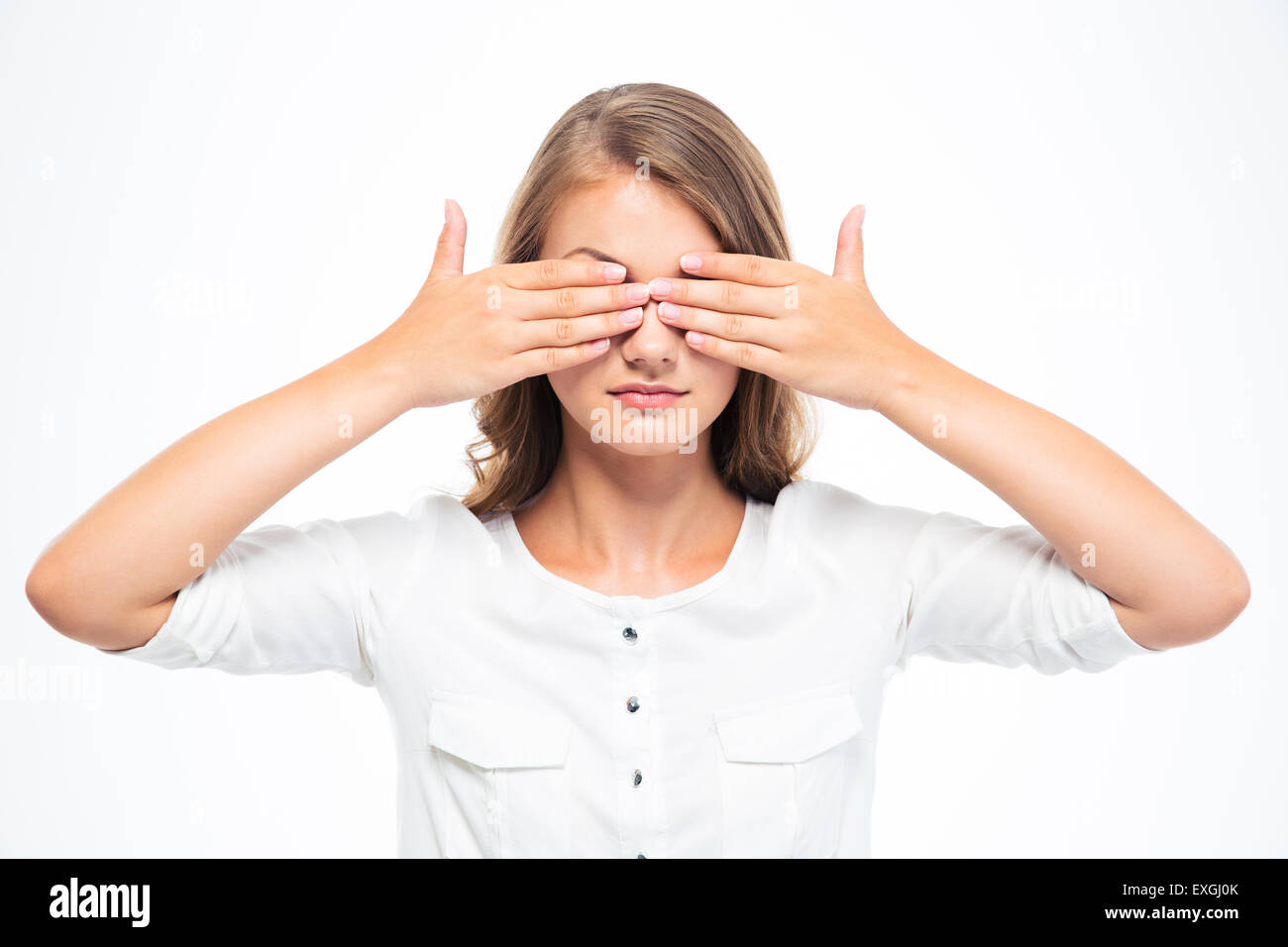 Young woman covering her eyes isolated on a white background Stock ...