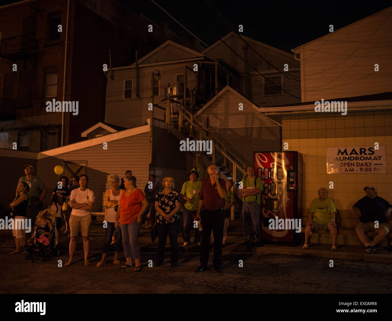 Attendee's of the Mars New Year's celebration watch fireworks on Friday ...