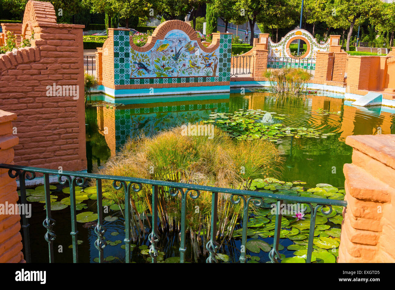 Andalusian style nice pond in the park of Malaga, Spain Stock Photo - Alamy