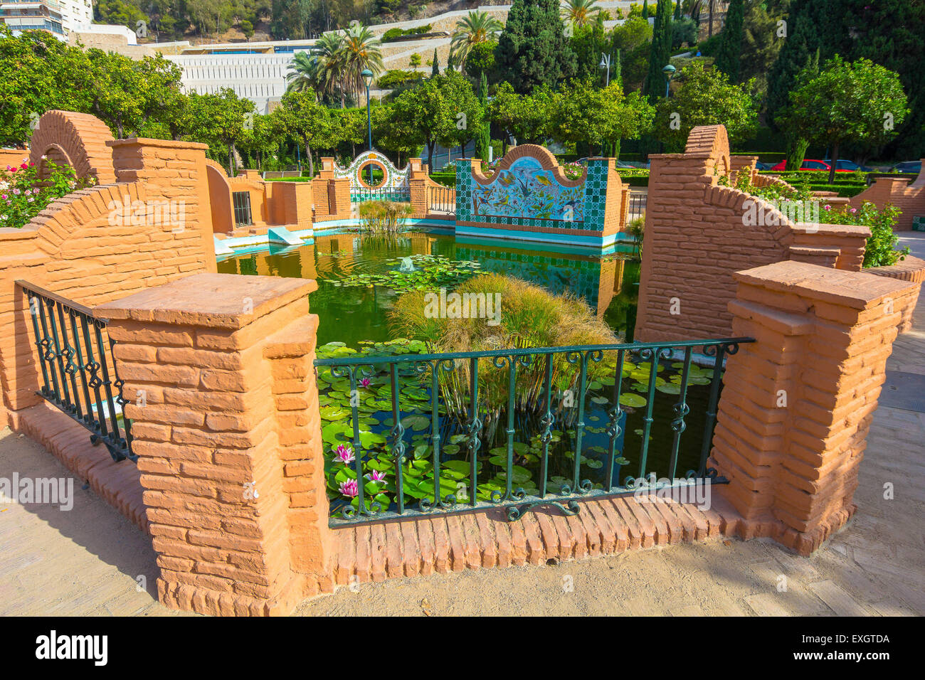 Andalusian style nice pond in the park of Malaga, Spain Stock Photo - Alamy