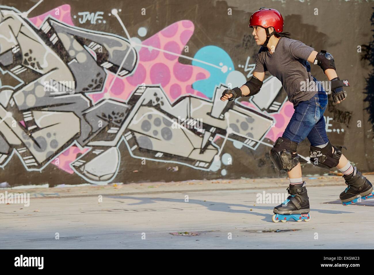 Young Man Rollerblading in the SCAPE Skate Park, Singapore Stock Photo ...