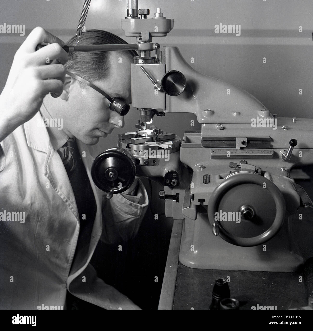 1950s historical picture of an adult male engineer in a white-coat ...