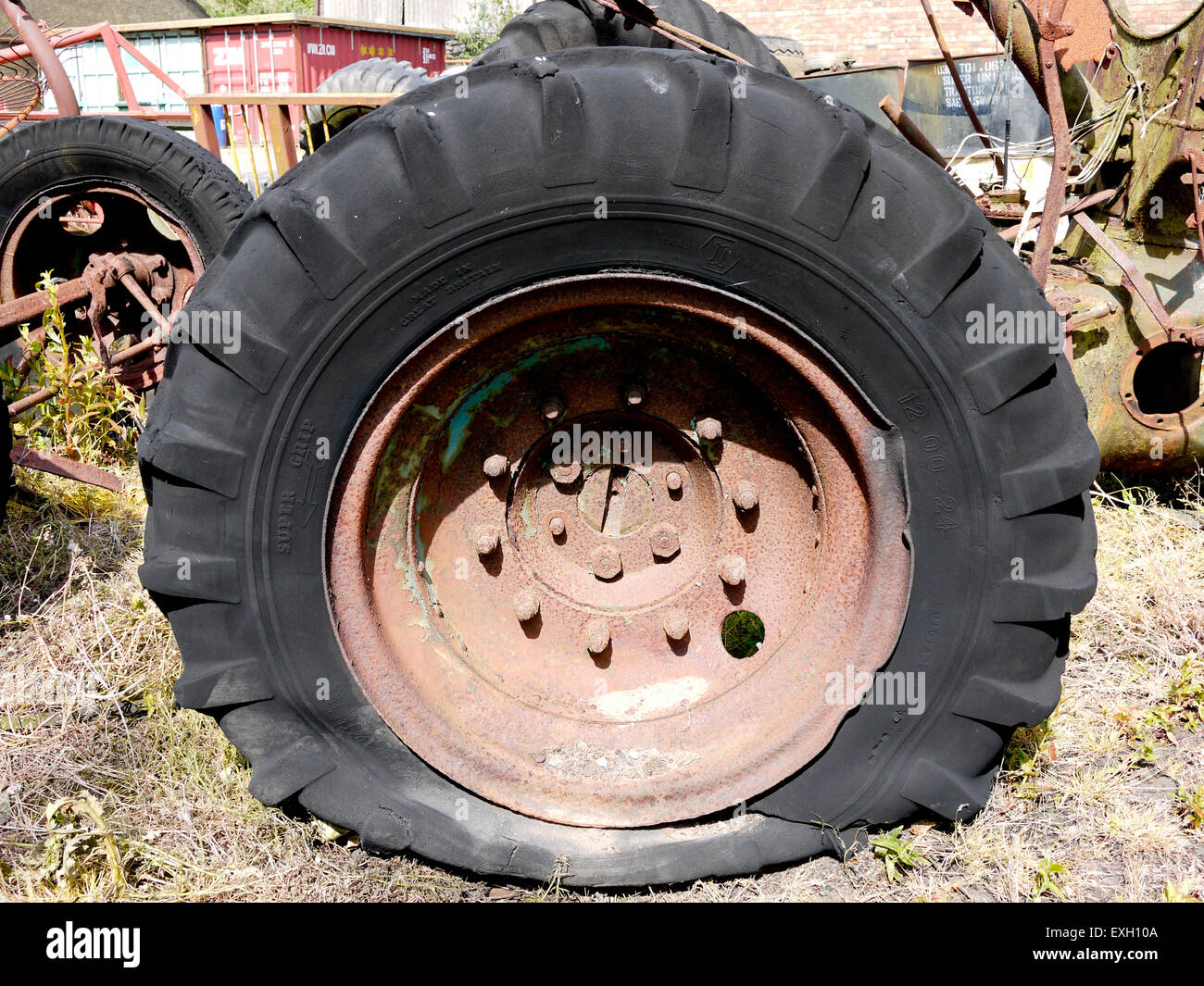 Old deflated tractor tyre, Scotland,UK Stock Photo - Alamy