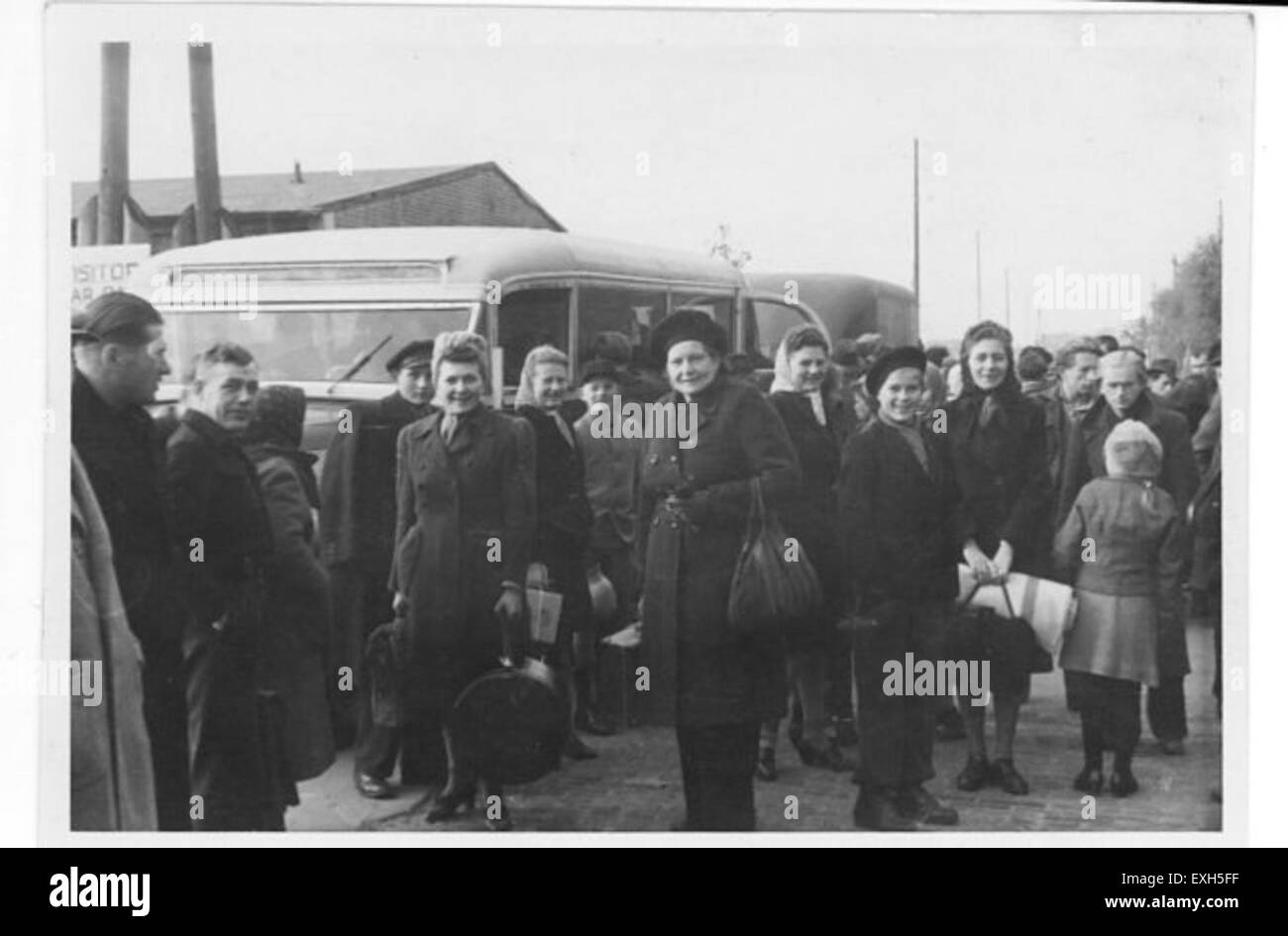 A group of Mennonites is seen boarding a bus, likely for a religious ...