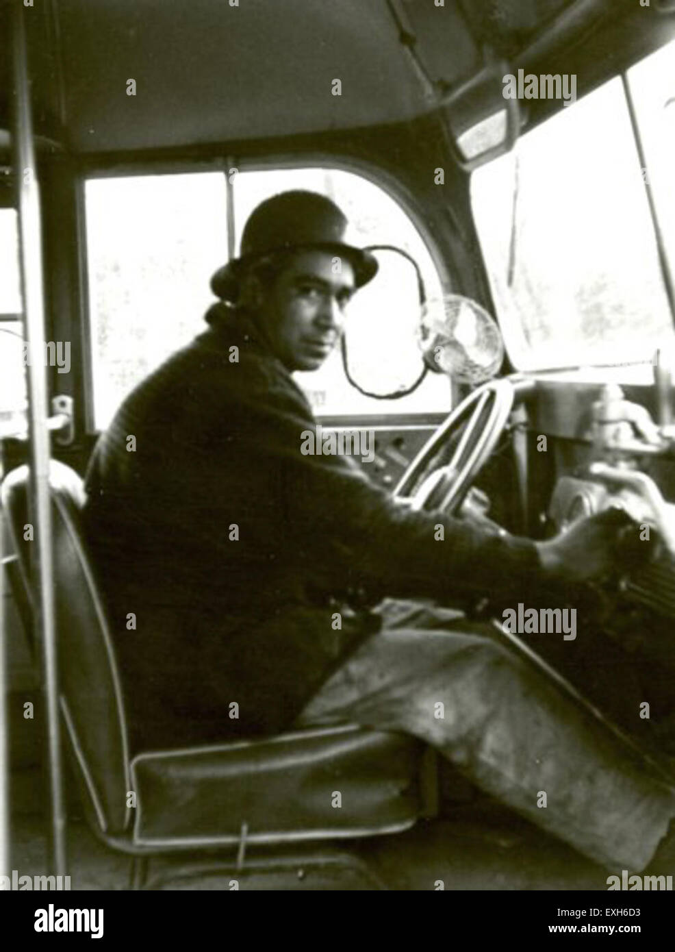 This image shows a Bushmen Contractors' bus driver in Marlboro, Alberta ...
