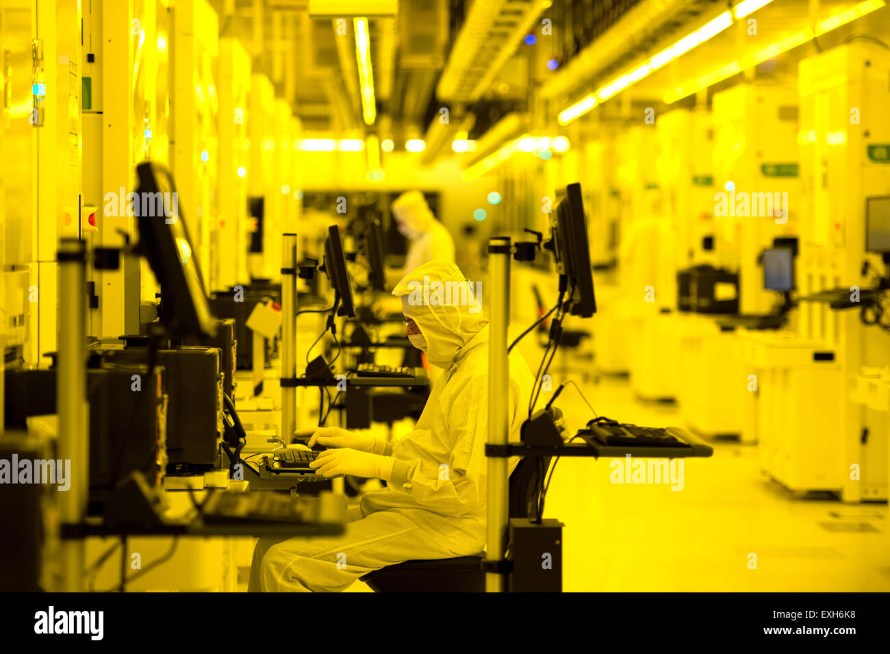 Dresden, Germany. 14th July, 2015. Employees work in the cleanroom on ...