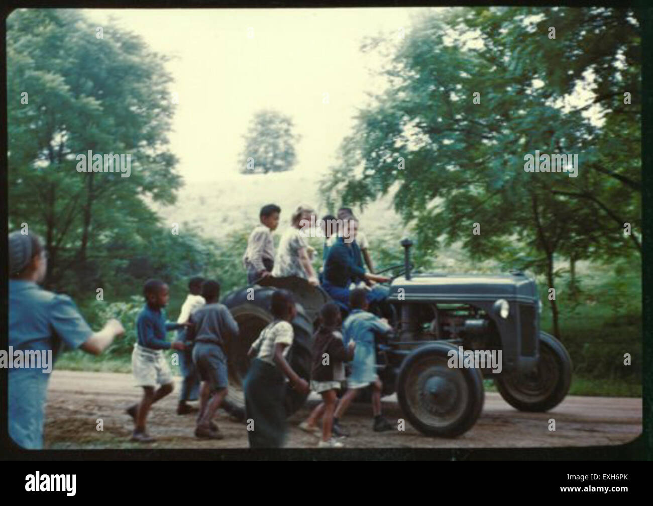 Camp Ebenezer Children Follow Tractor Stock Photo - Alamy