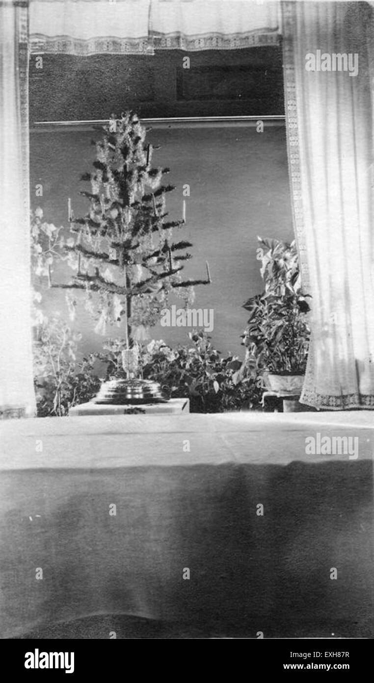 The 'Christmas at Home' scene depicts a family celebration in a ...