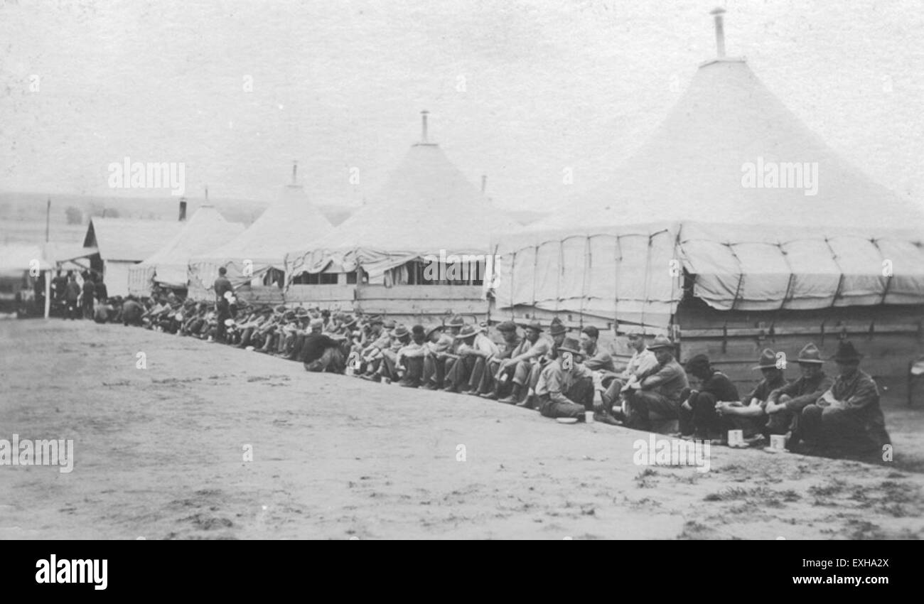 In Camp Funston, individuals were lined up in a detention camp as part ...